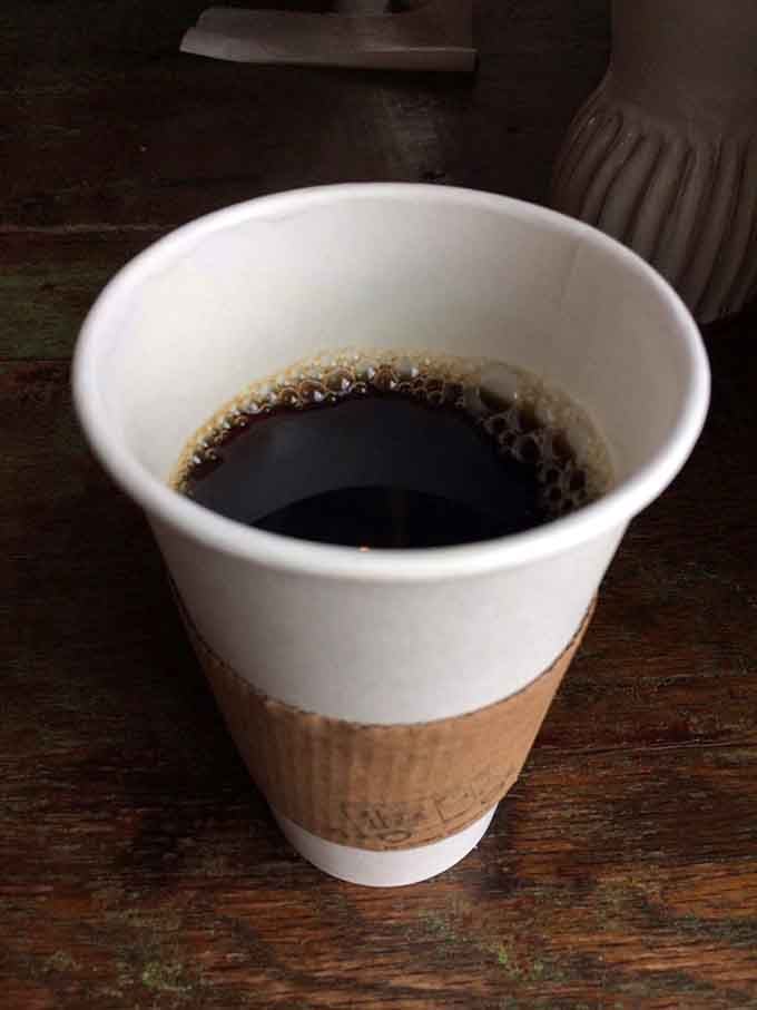 Hot coffee in a simple cup, no fancy latte art required when you're pairing it with world-class donuts.