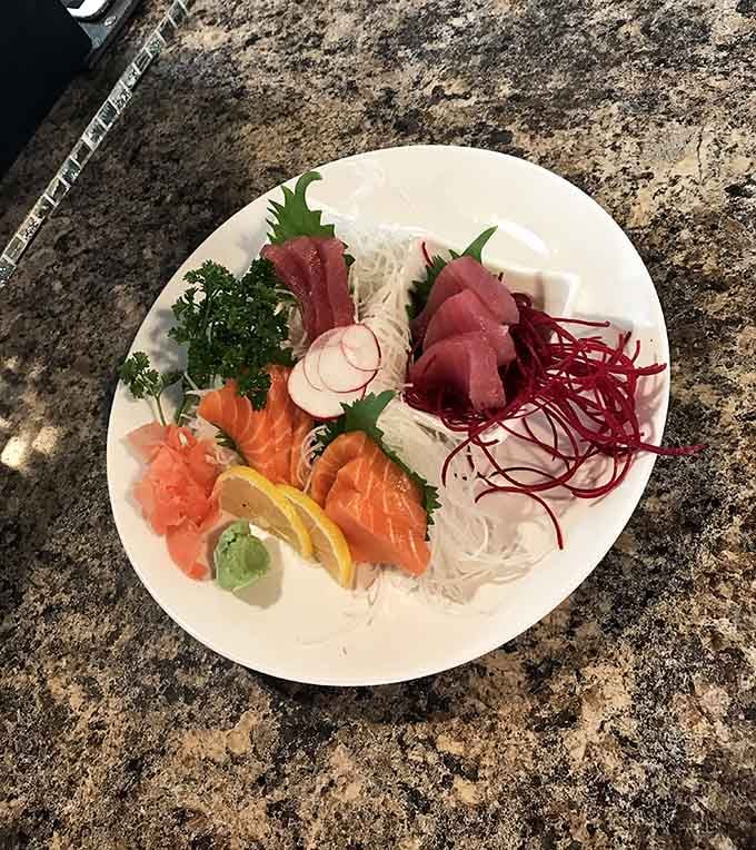 Fresh sashimi arranged like edible art, proving that landlocked states can absolutely deliver on quality raw fish.