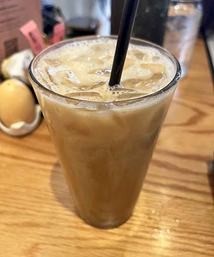 That creamy iced latte glistening with condensed beads promises the caffeine jolt your morning desperately needs right about now.
