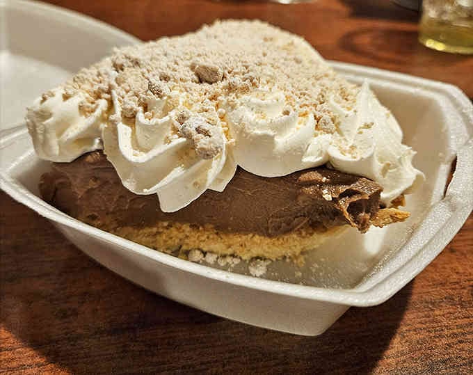 That chocolate peanut butter pie with its mountain of whipped cream is basically edible happiness in a container.