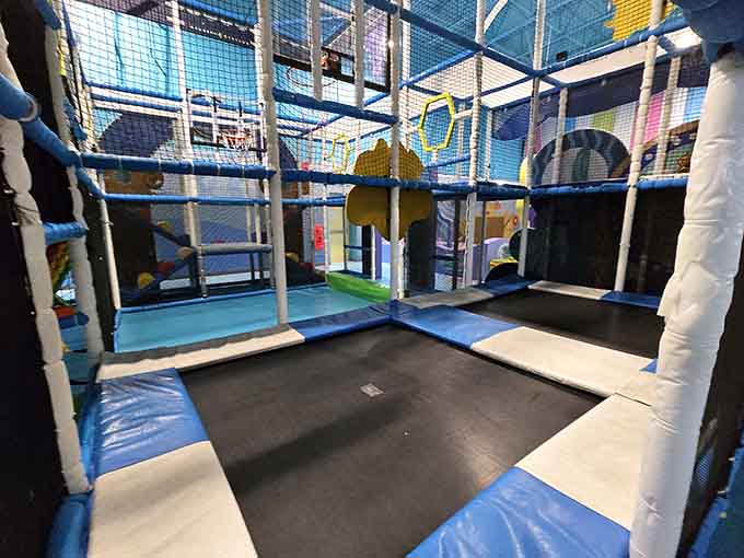Trampolines surrounded by safety netting, because bouncing should be fun, not a trip to urgent care.