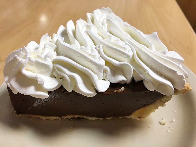 Chocolate cream pie topped with enough whipped cream to make your cardiologist schedule an intervention meeting immediately.