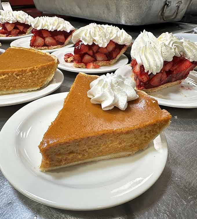 Sweet potato pie and strawberry pie topped with whipped cream offer the perfect finale to any home-cooked feast.
