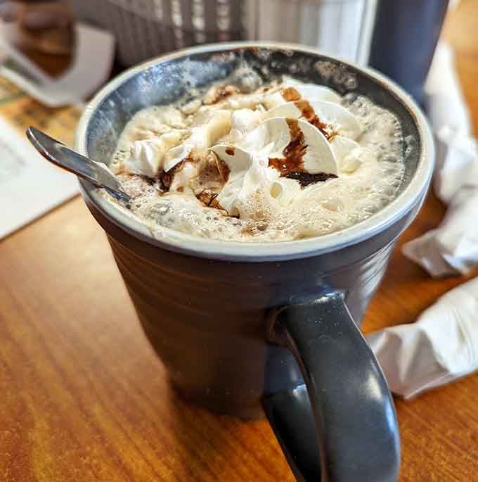 Hot chocolate topped with whipped cream that's basically a cloud you can eat with a spoon.