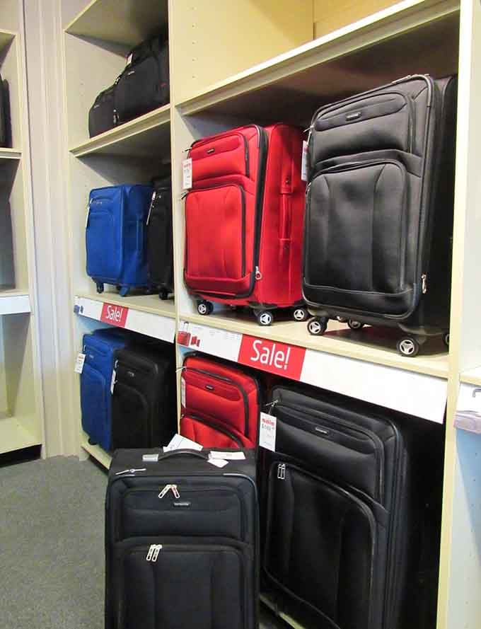 Luggage in every color of the travel rainbow, ready to carry your dreams and your savings on future adventures.