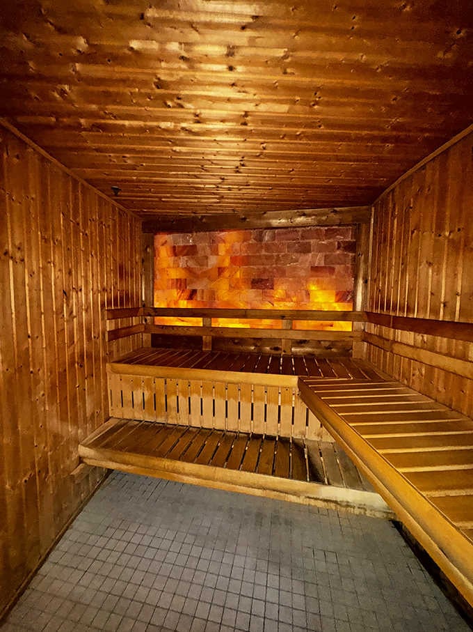 That glowing Himalayan salt wall and cedar embrace make this sauna feel like a warm hug.