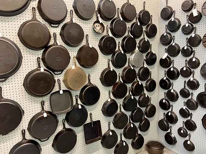 Cast iron skillets covering an entire wall&mdash;because apparently one pan that lasts forever just isn't enough for collectors.