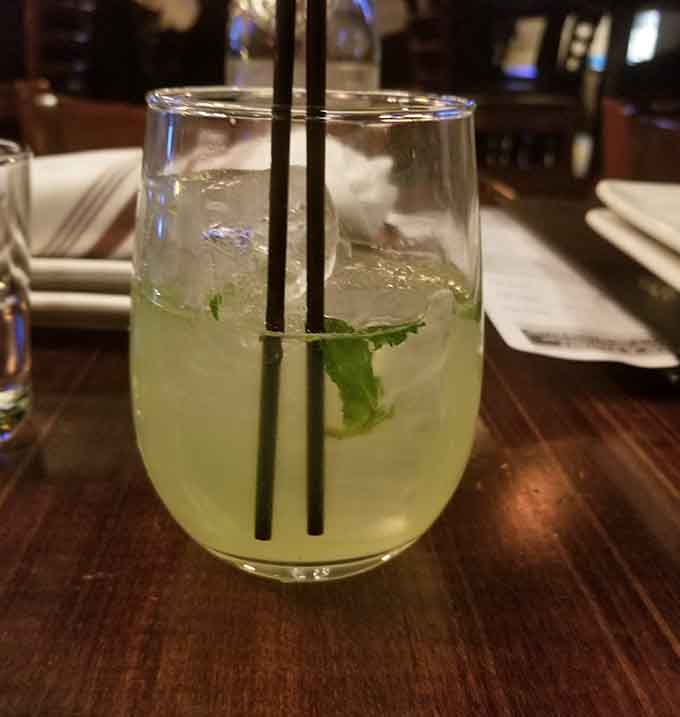 A refreshing cocktail that looks like summer in a glass, complete with mint and enough citrus to make you forget it's winter.