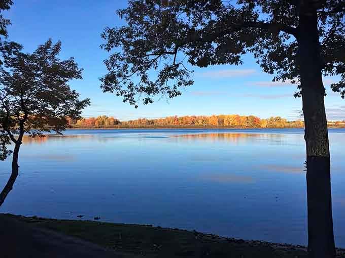 When the lake reflects the autumn trees like a mirror, you'll understand why people never leave this state.