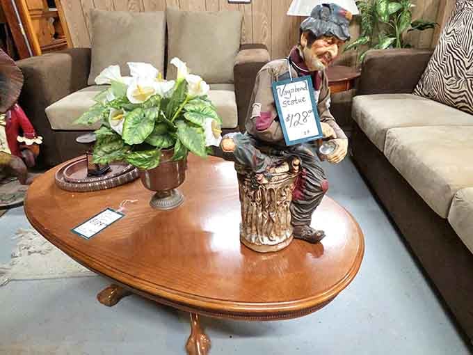 This vagabond statue perched on a coffee table perfectly captures the whimsical spirit that defines every corner here.