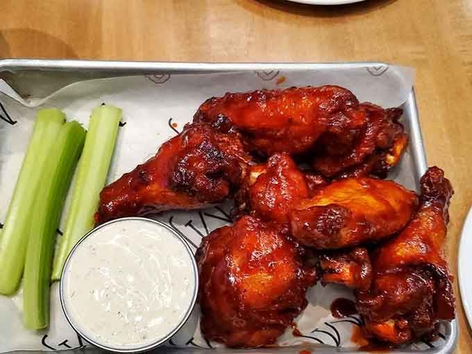 Wings glazed to sticky perfection, the kind that require extra napkins and zero regrets about the mess you're about to make.