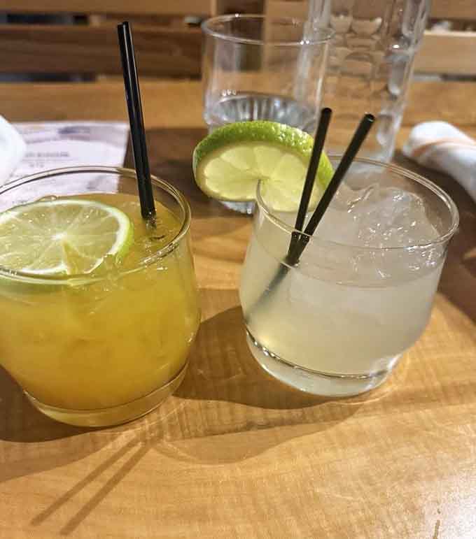Fresh margaritas catching the light on wooden tables, the perfect companion to your coastal feast in landlocked Alabama.