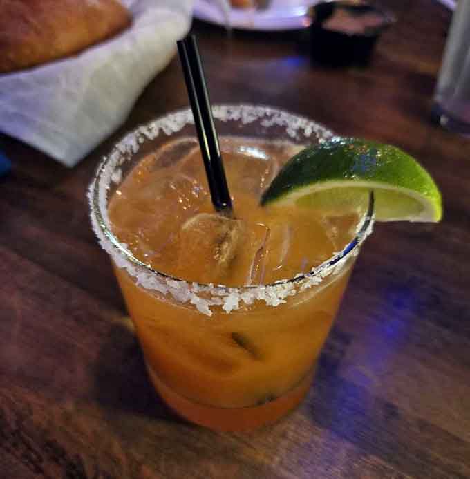 A passion fruit margarita that tastes like vacation in a glass, minus the sunburn and questionable souvenir purchases.