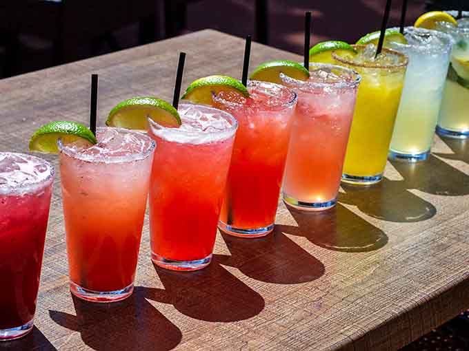 A margarita rainbow stretches across the bar, each vibrant hue promising its own delicious escape from reality.