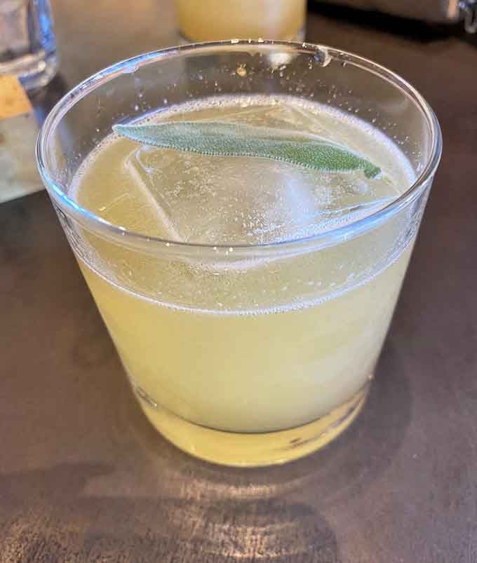 A refreshing cocktail with sage garnish proves this noodle bar knows how to keep things interesting.