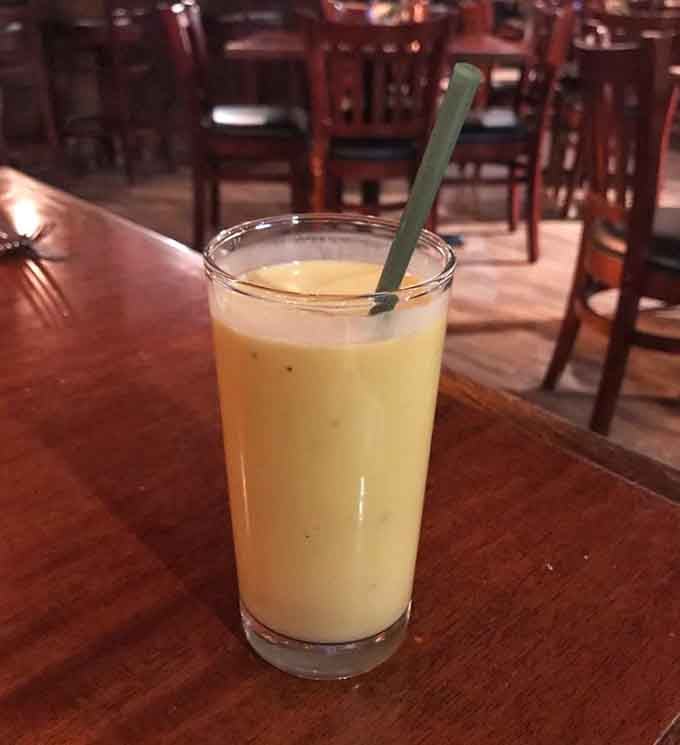 Mango lassi: the creamy, sweet antidote to your spice ambitions, basically a hug in a glass for your burning mouth.