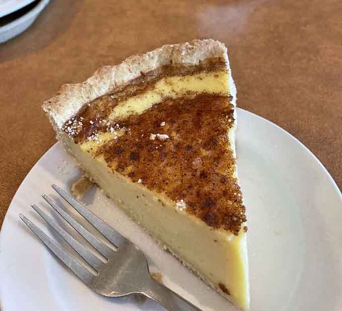 That towering lemon meringue pie with its golden peaks is basically edible sunshine on a plate.