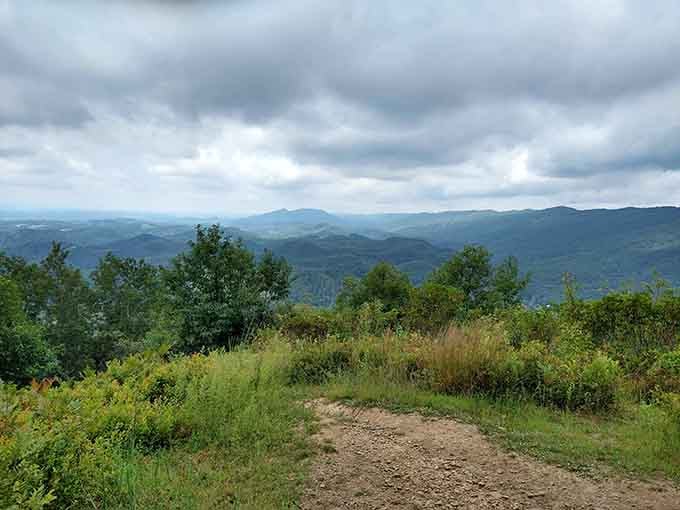 Dramatic clouds rolling over mountain ridges create a moody masterpiece that changes by the minute, never the same twice.