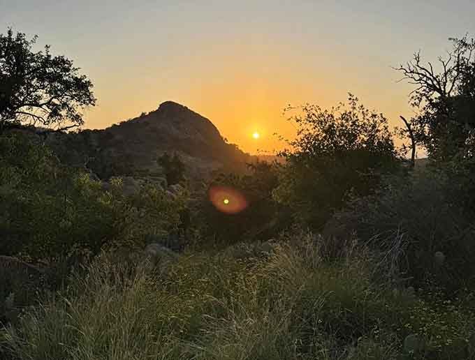 Golden hour at Enchanted Rock proves that some sunsets are worth getting off the couch for, even without air conditioning nearby.
