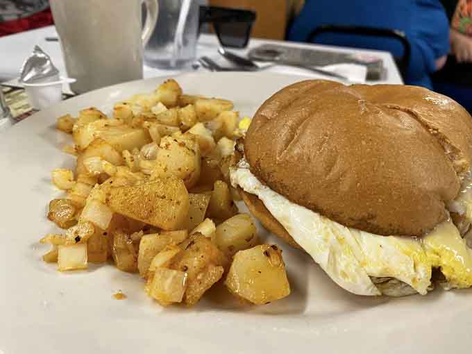 That egg sandwich with crispy potatoes represents everything right about no-nonsense American breakfast.