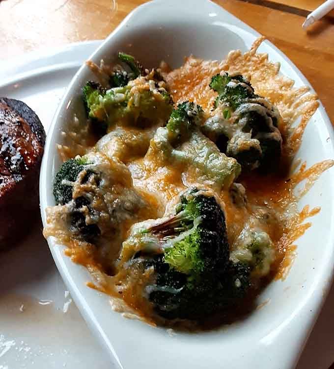 Broccoli swimming in cheese sauce transforms vegetables into something your inner child would actually request for dinner.