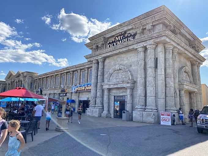 Classical columns frame modern shops where you can grab snacks between conquering roller coasters and water slides.