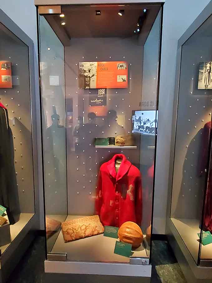 That vintage red jacket and weathered leather ball tell stories from basketball's earliest days when the game began.