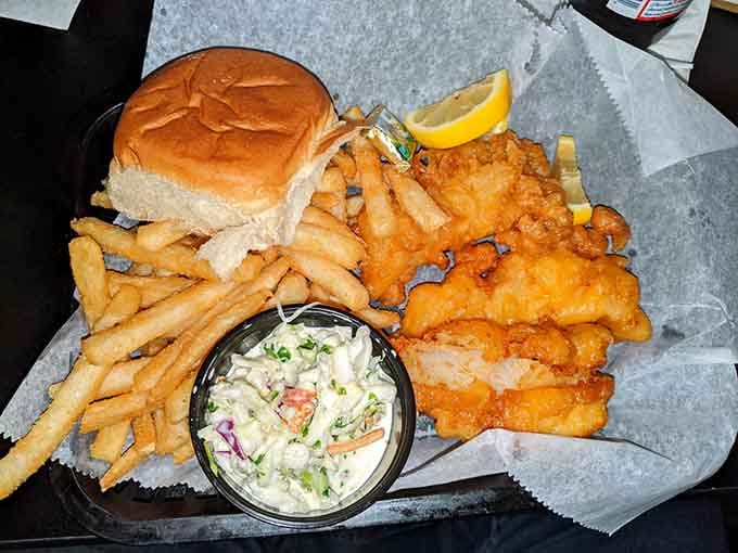 Golden-fried fish and chips with creamy coleslaw, because even haunted bars understand the importance of proper comfort food.
