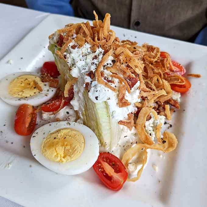 This wedge salad topped with crispy onions shows that even the classics get the royal treatment at Nemo Grille.
