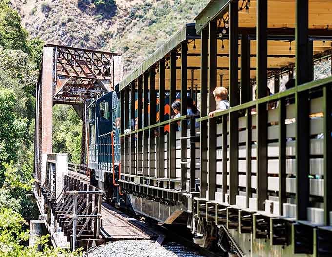 Crossing a canyon bridge on vintage rails delivers thrills that no theme park ride can match, guaranteed.
