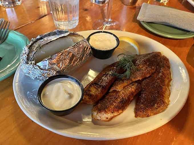 Fresh walleye fillets with a foil-wrapped baked potato represent Minnesota dining at its most authentic and delicious.