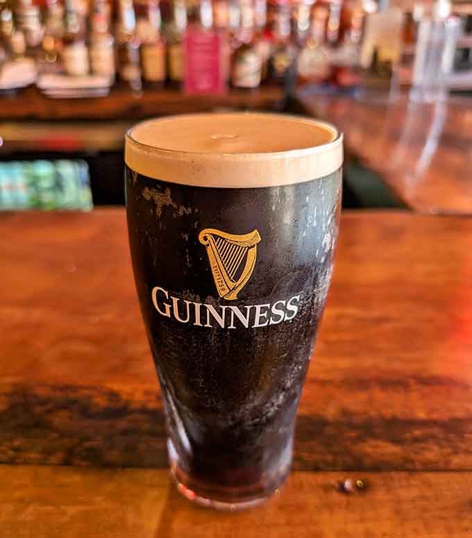 A perfectly poured Guinness sitting pretty at the bar, waiting to make someone's day infinitely better.