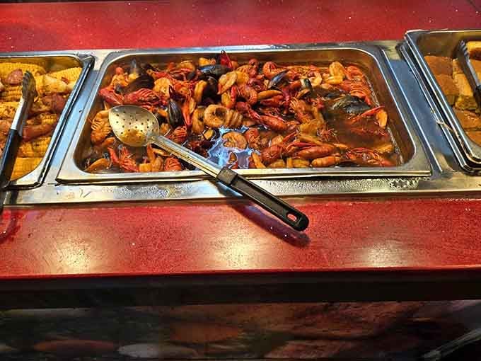 That crawfish boil sitting in the steam tray like edible treasure, ready to transport you straight to Louisiana.