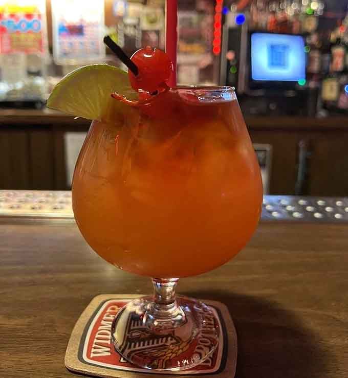 This tropical Mai Tai garnished with lime and cherry is exactly what you need before hitting the disco floor later.