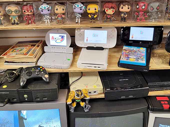 Vintage gaming consoles lined up like a museum of childhood memories, complete with Funko Pop guardians watching over.