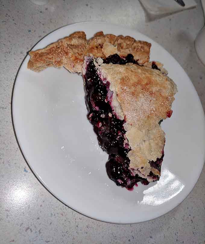 That generous slice of berry pie with its flaky crust could make a dessert-for-breakfast argument pretty convincing.