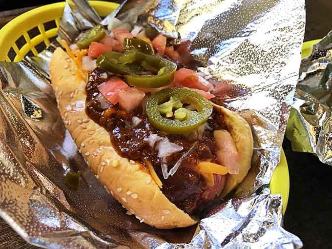 A hot dog dressed to the nines with chili and jalape&ntilde;os, ready to party in your mouth.