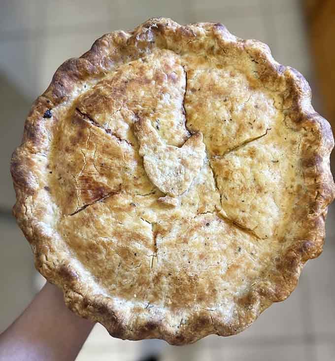 Golden chicken pot pie with a top crust so flaky, it should require its own napkin.