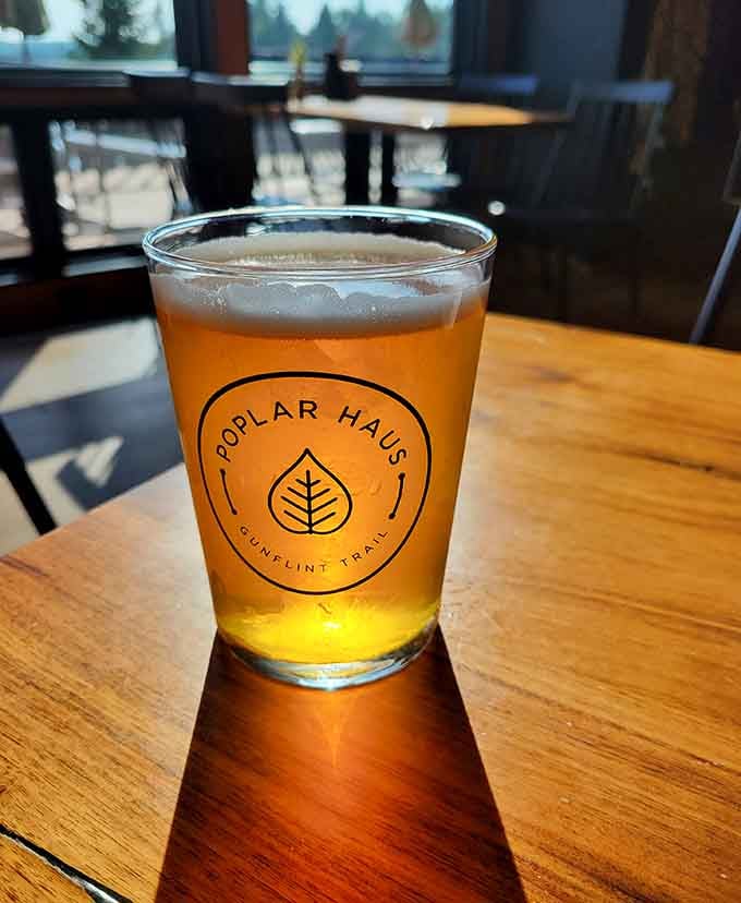 A perfectly poured craft beer in a Poplar Haus glass, ready to complement whatever deliciousness you've ordered.