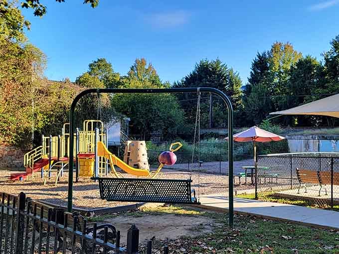 Rice Tot Lot park offers swings and slides where kids play surrounded by more history than most museums contain.