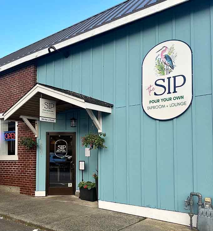 The heron logo and mint-green siding whisper relaxation louder than any neon sign ever could, pure coastal charm.