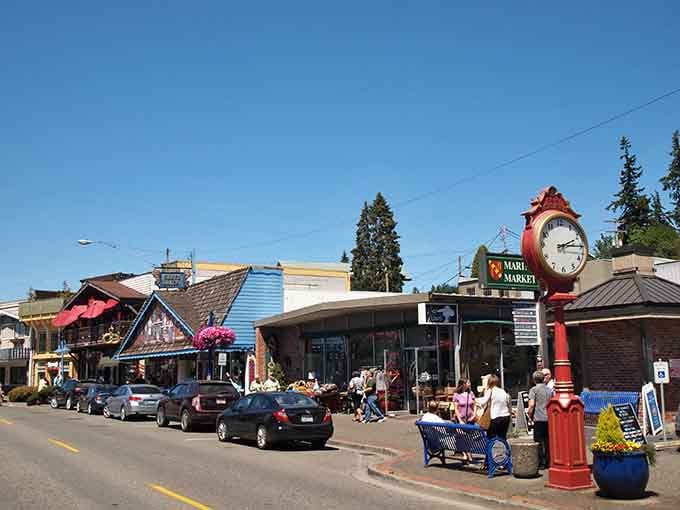 That iconic red clock tower stands sentinel over bustling streets where shoppers discover treasures in every charming storefront.