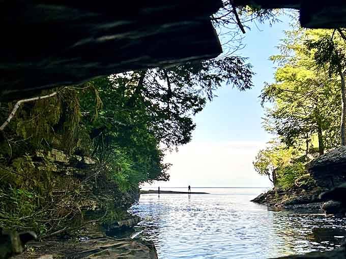 Peeking through rock formations to glimpse Lake Superior feels like discovering a secret the forest has been keeping.