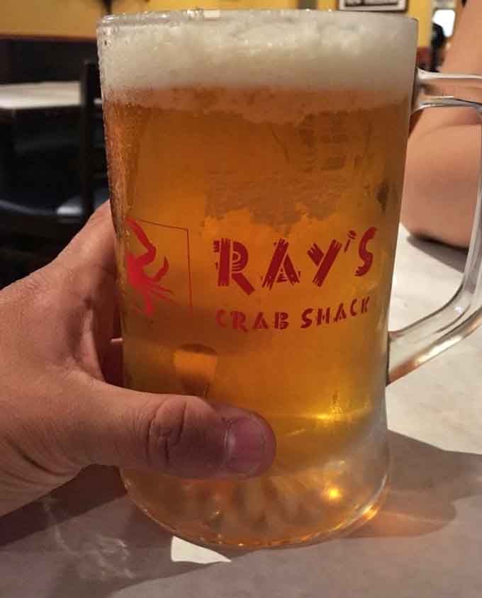 That frosty mug of beer with Ray's logo is the perfect companion for cracking crab and making memories.