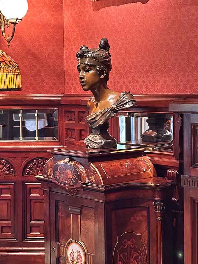 This bronze bust has seen more elegance in one room than most of us see in a lifetime.