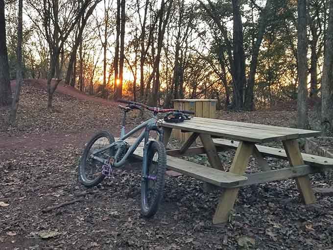 Golden hour at the rest area, where tired legs recover and riders swap stories about their most spectacular runs.