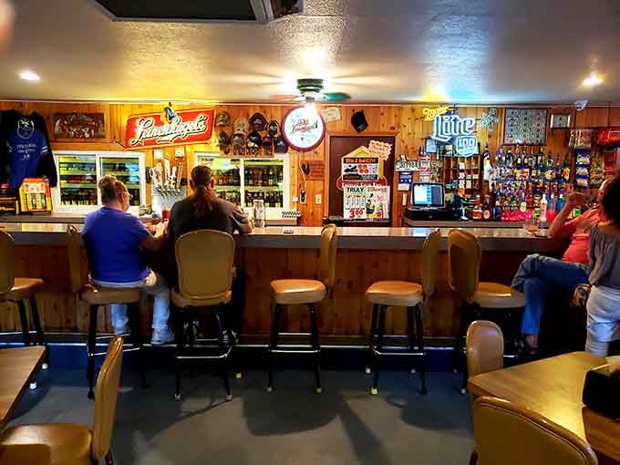 The bar where Leinenkugel's flows and locals gather, wood and neon creating that perfect tavern atmosphere we love.