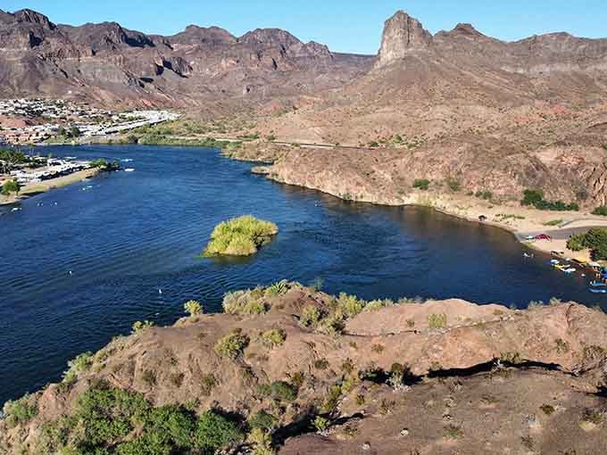 The Colorado River carving its way through the landscape like it's been doing this forever, because it has.