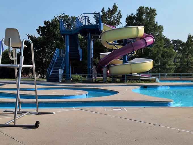 Those colorful water slides twist and turn like a carnival ride designed specifically for summer joy.