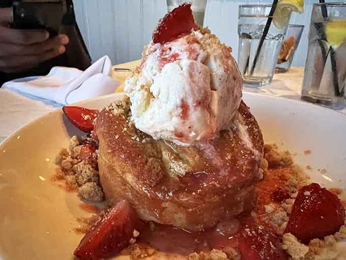 Warm butter cake topped with ice cream and berries makes dessert feel like a standing ovation.